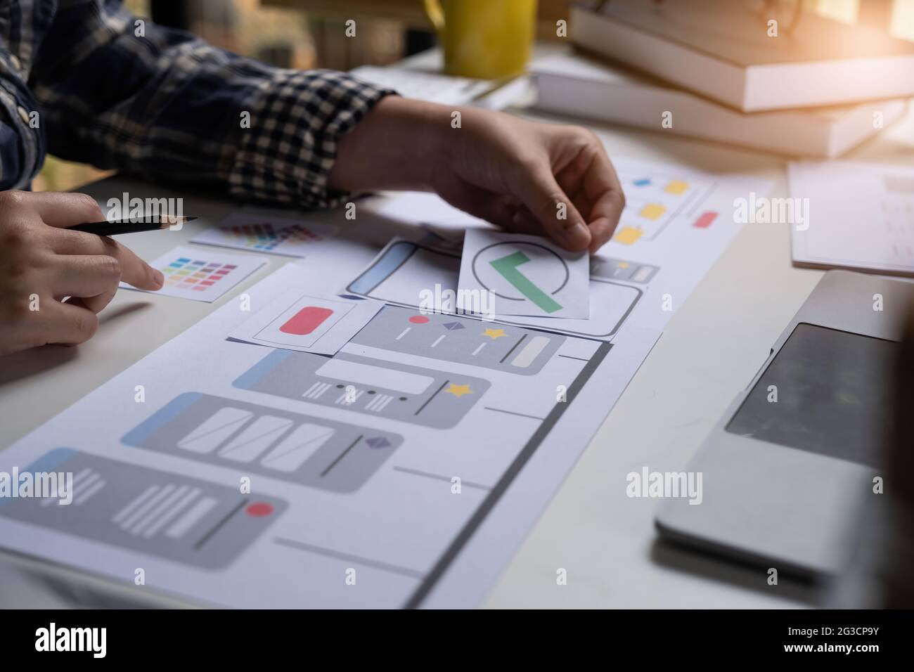 A close-up of an ux ui developer and an ui designer working on a mockup ...