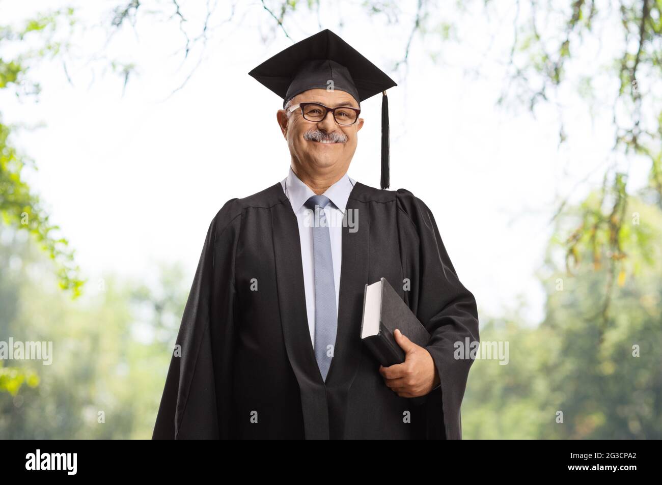 College dean in graduation gown hi-res stock photography and images - Alamy
