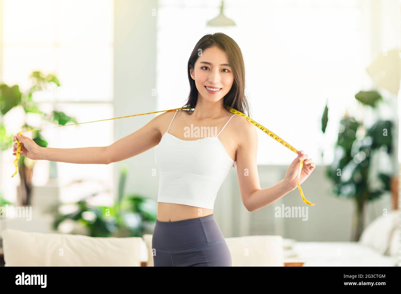 Woman with ruler hi-res stock photography and images - Alamy