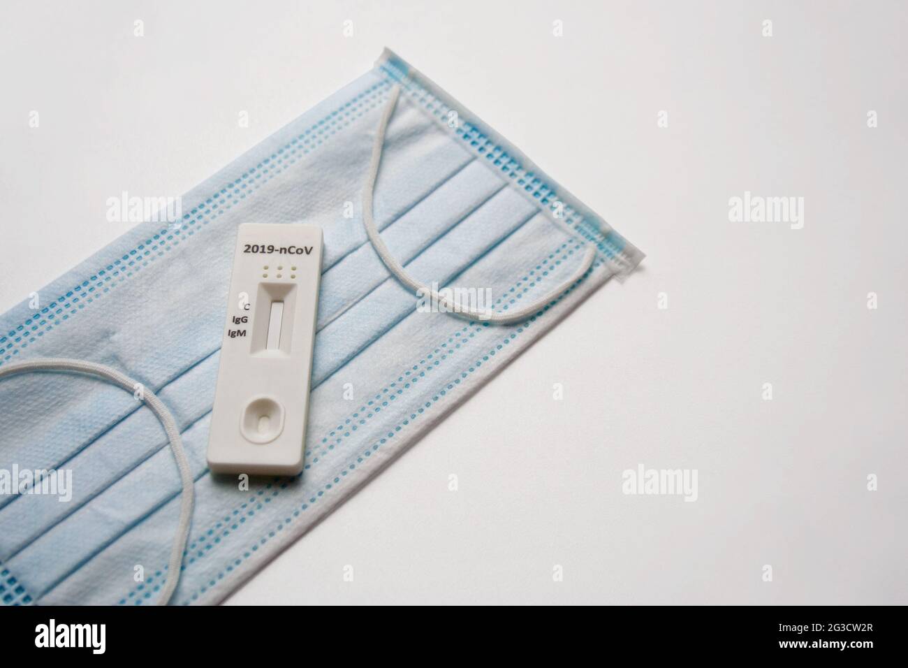 Covid-19 PCR test and medical face mask isolated on white background ...