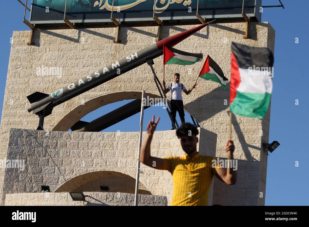 Rafah, Gaza. 15th June, 2021. A Palestinian holds the national flag ...