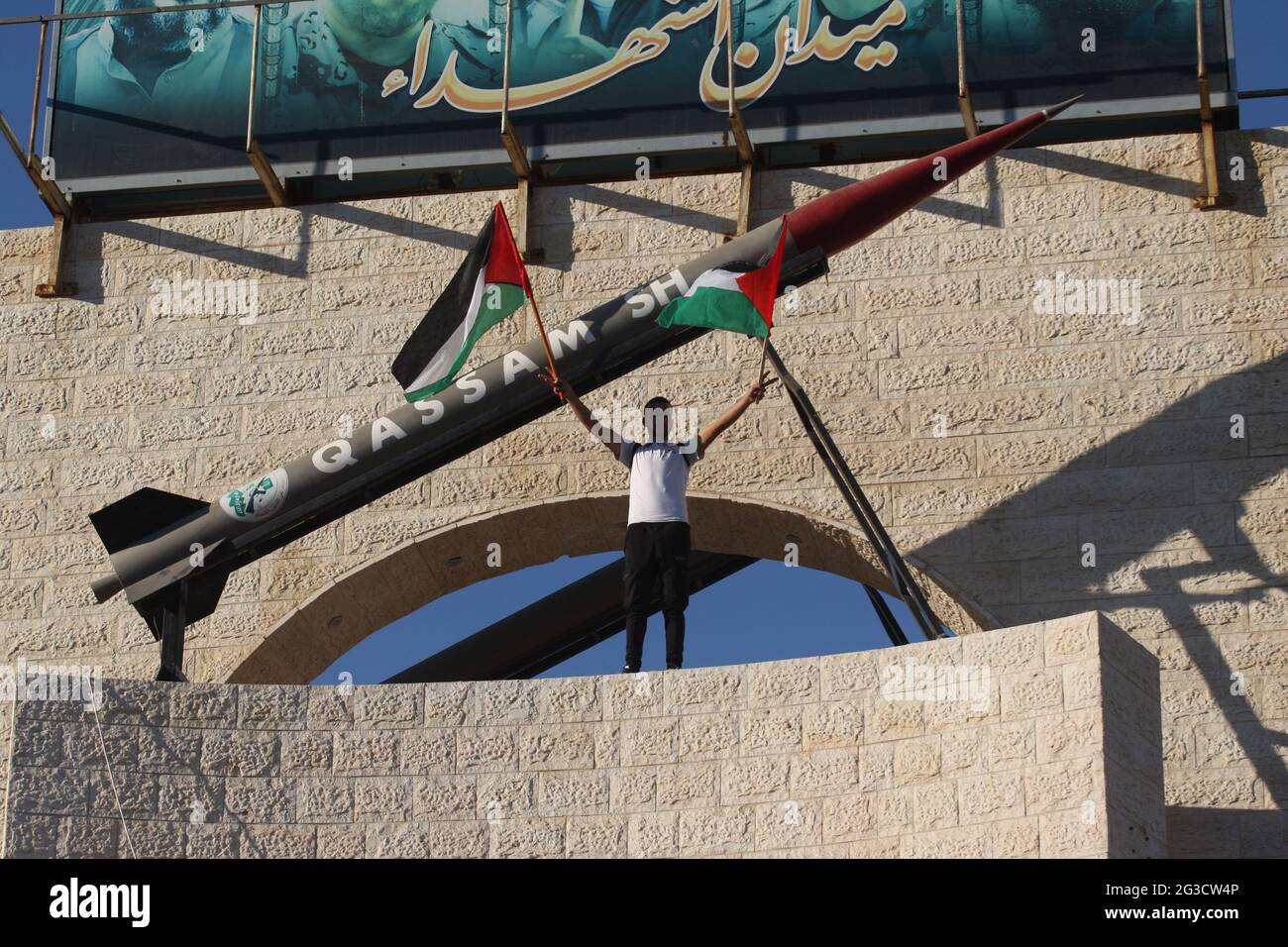 Rafah, Gaza. 15th June, 2021. A Palestinian holds the national flag ...