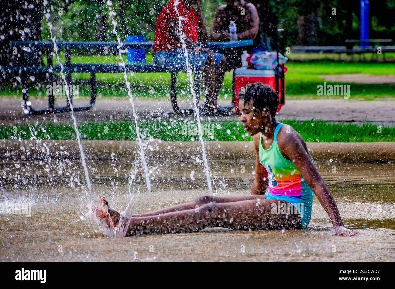 Girl play water fountain in hi-res stock photography and images - Alamy