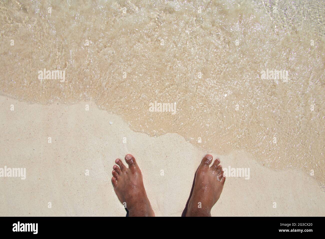 Feet in the sand hi-res stock photography and images - Alamy