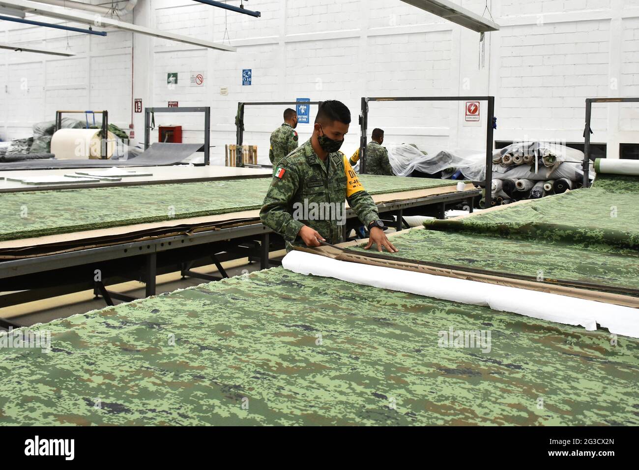 To produce military uniforms hi-res stock photography and images - Alamy
