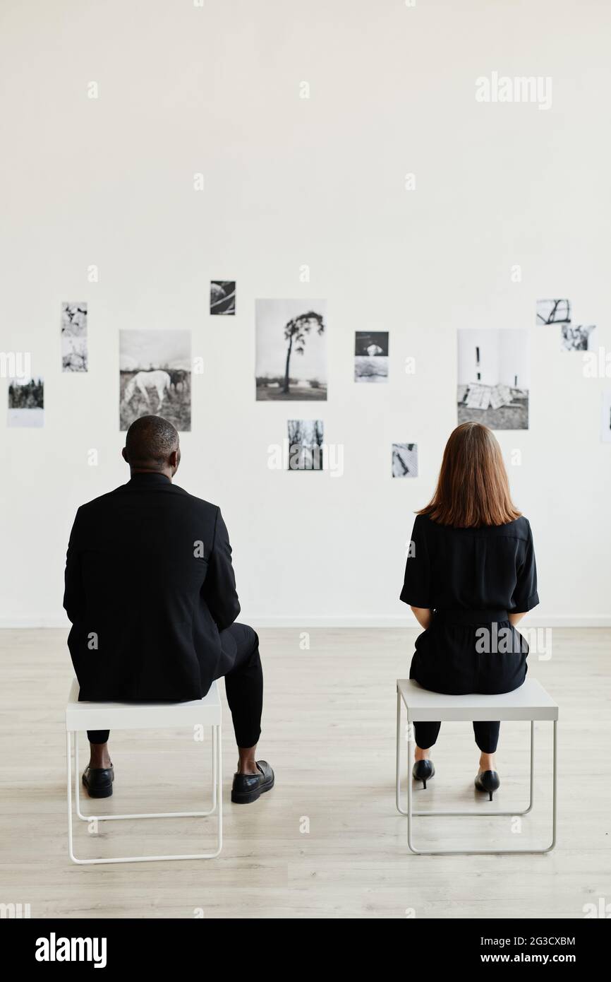 Graphic back view at elegant couple looking at black and white ...
