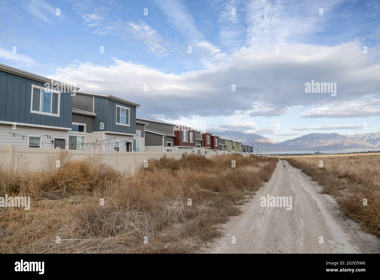 Closeup shot of a landscape with cubic houses in raw and open fields ...