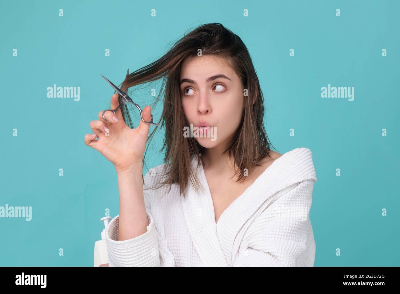 Woman with a comb in his hand on a white background distressed hair ...