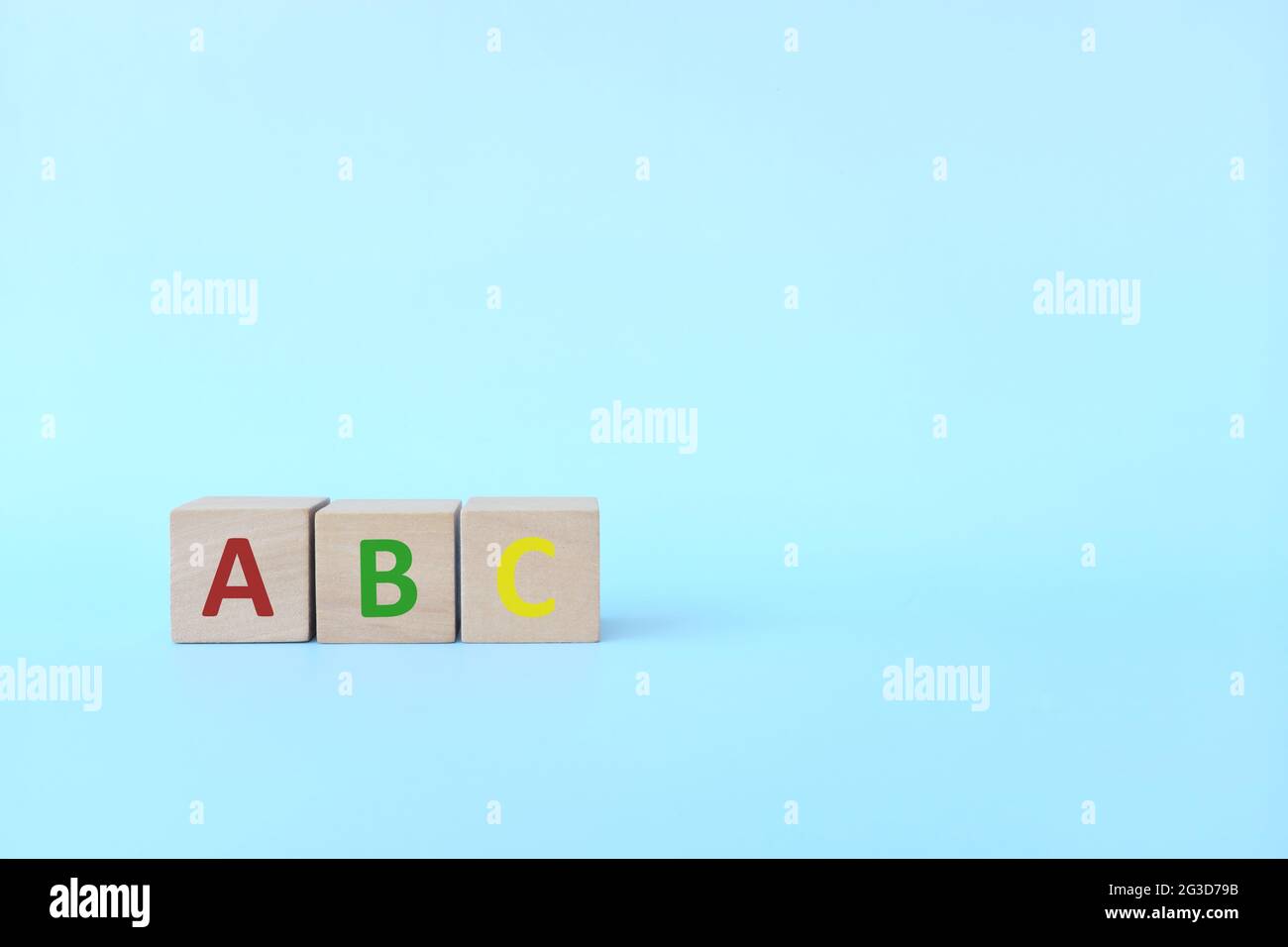 Colorful ABC letters on wooden blocks in blue background with copy ...