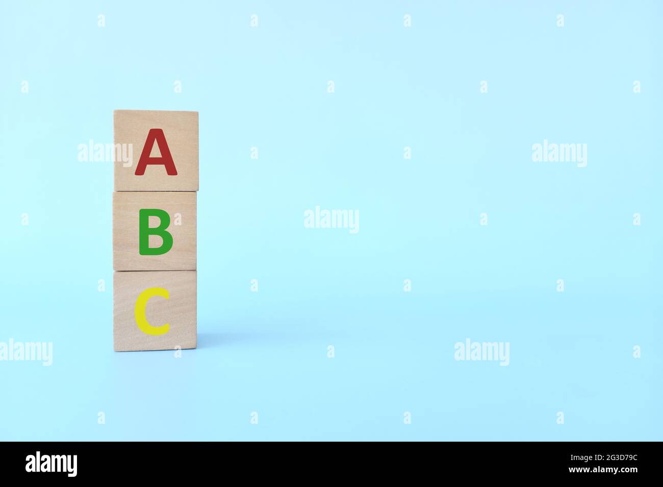 Colorful ABC letters on wooden blocks in blue background with copy ...