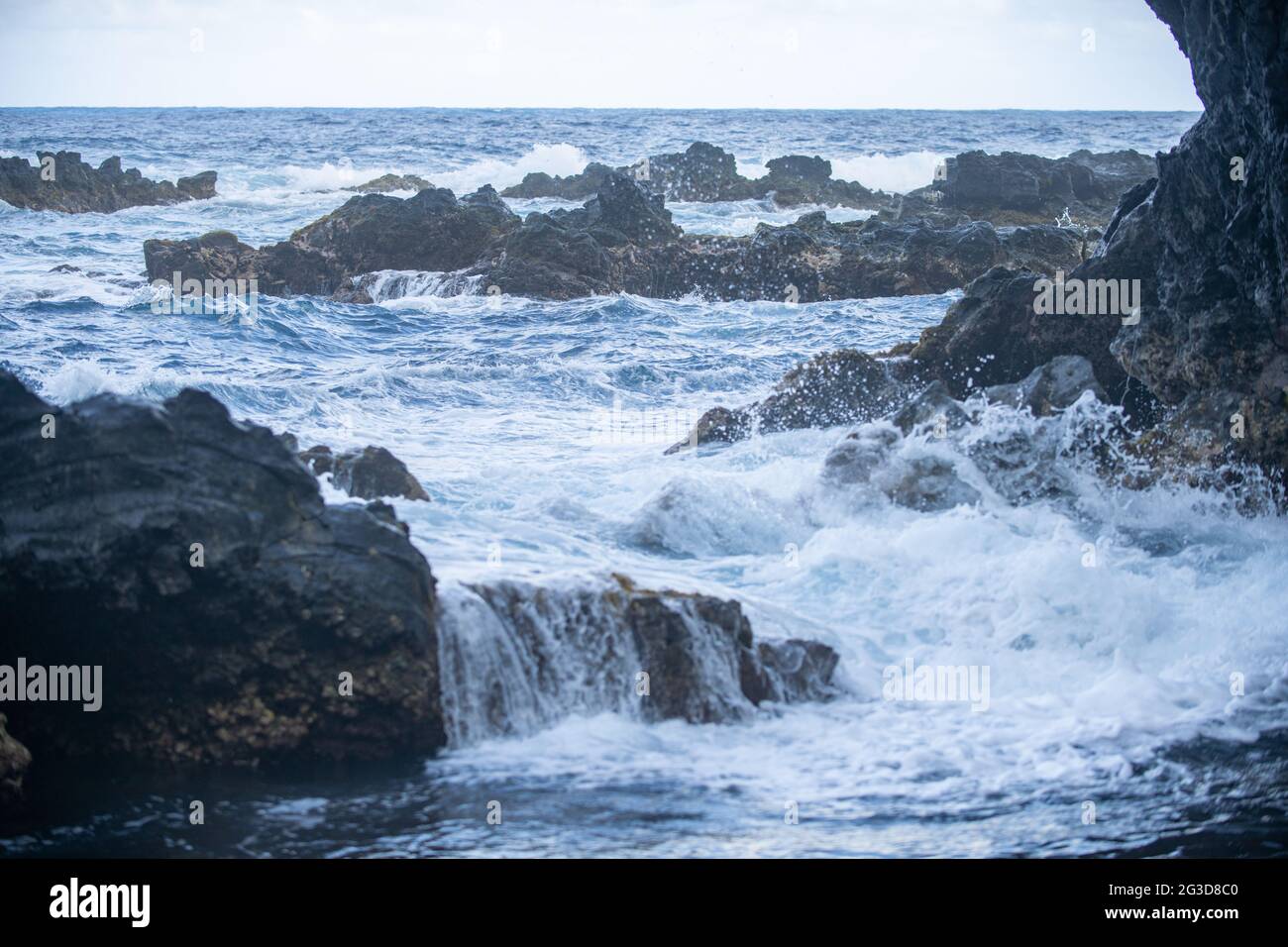 Splashing waves on the rock in the sea. Wave hit the stone in the ocean ...