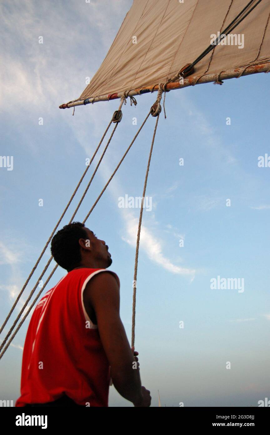 Luxor, Egypt - January 6, 2006: An Egyptian sailor operating the ropes ...