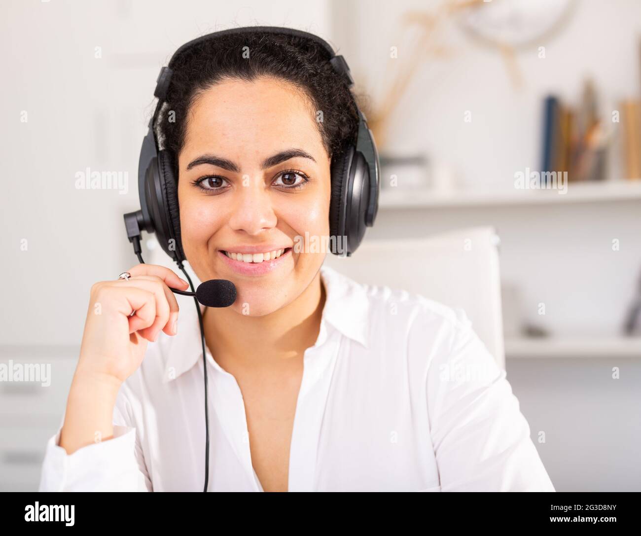 Happy call center operator talking with client at office Stock Photo ...