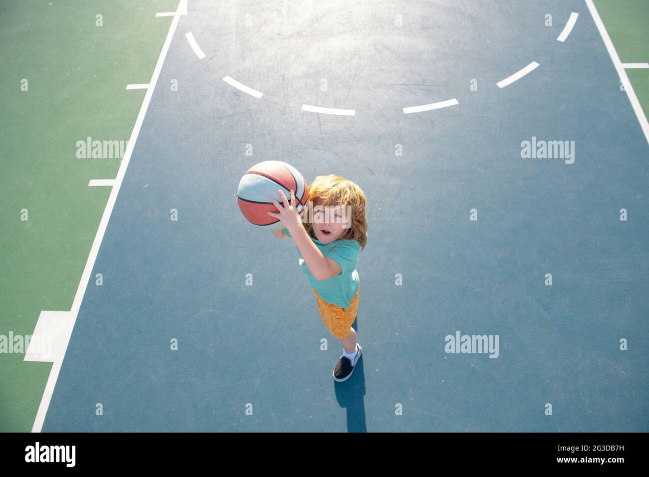 Kids playing basketball, outdoor on playground. Child sport activity ...