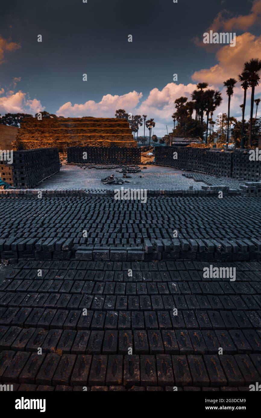 Vertical shot of Chichen Itza under a cloudy sky at sunset Stock Photo ...