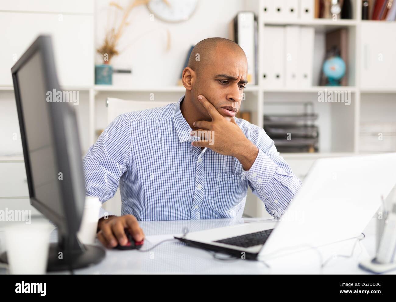 Tired businessman typing on computer hi-res stock photography and ...