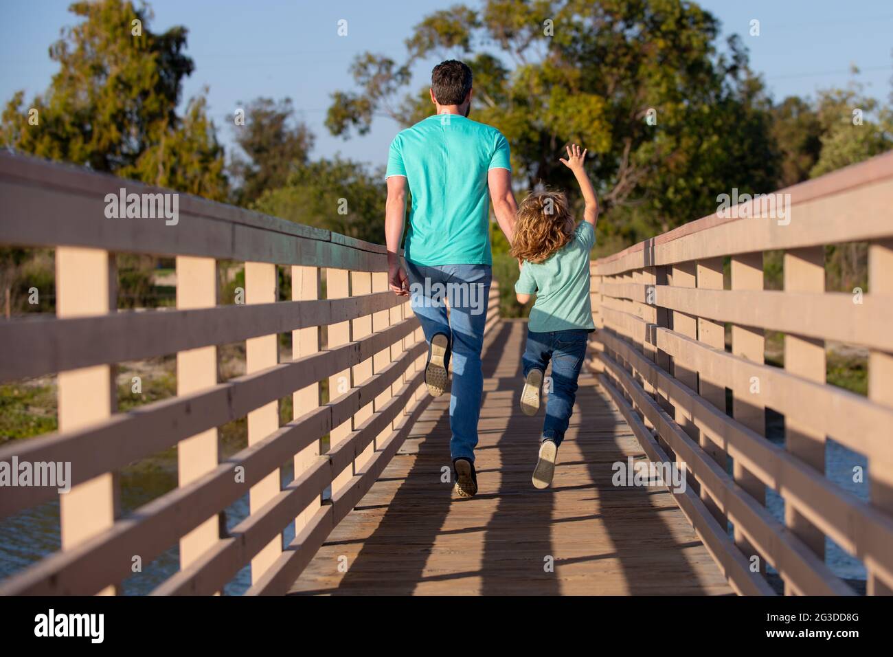 Back view portrait of happy father and son Stock Photo - Alamy