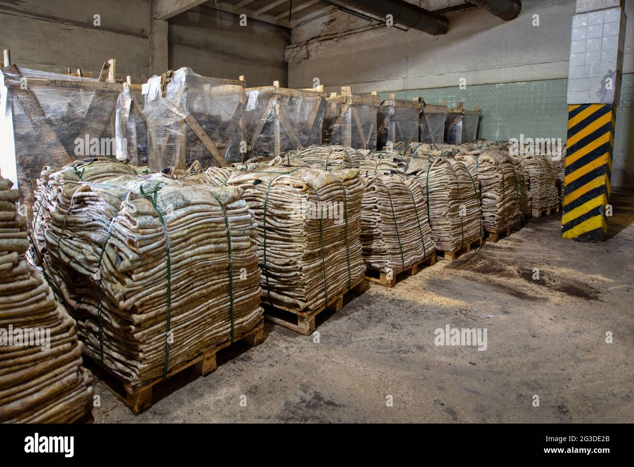 Raw salted cow skins are piled up Stock Photo - Alamy