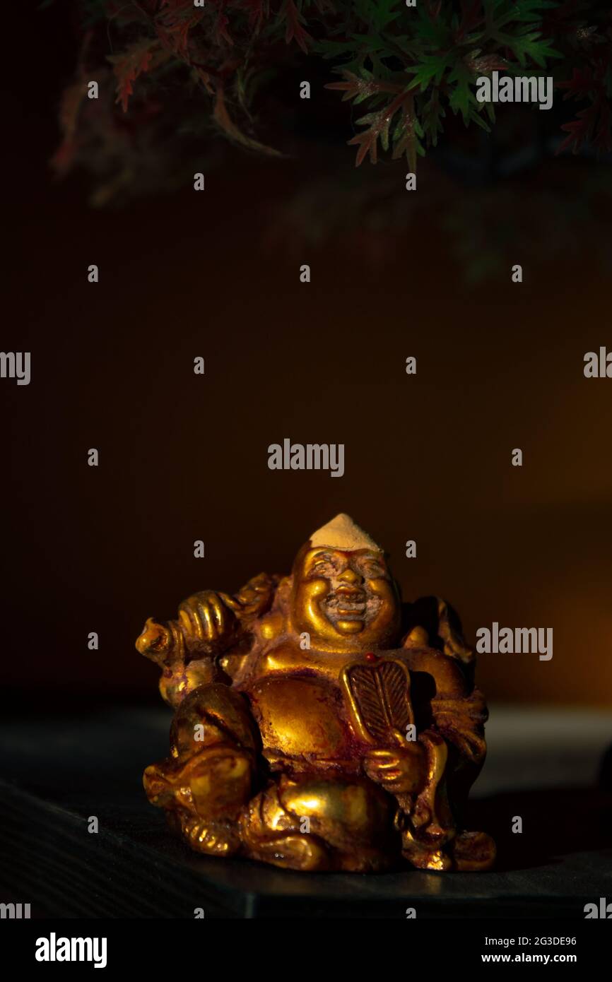 Laughing Buddha Statue on under the Tree. Statue of Laughing Buddha ...