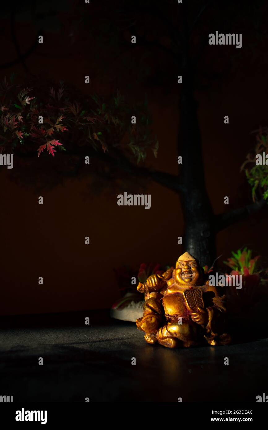 Laughing Buddha Statue on under the Tree. Statue of Laughing Buddha ...