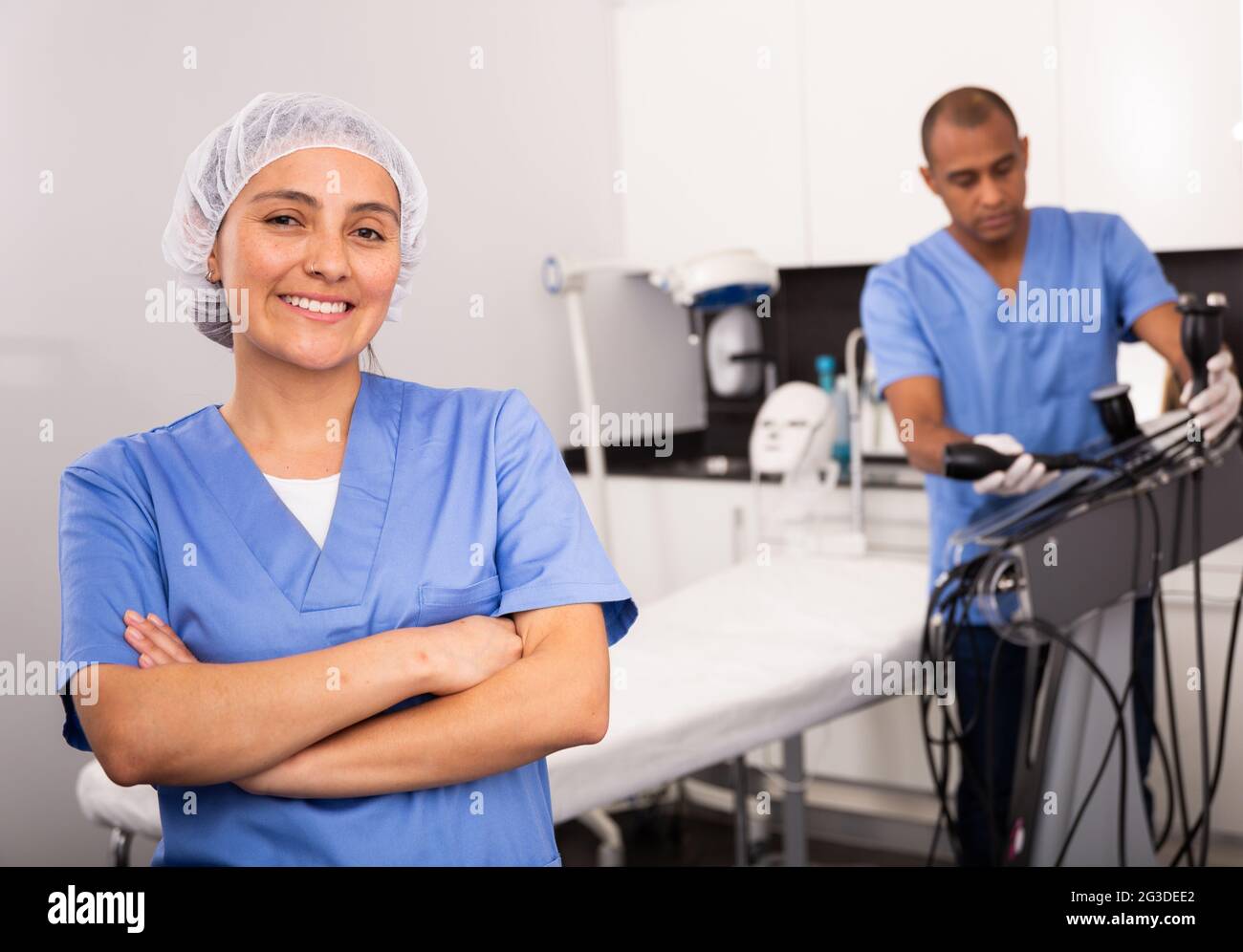 Smiling woman professional beautician in aesthetic cosmetology office ...