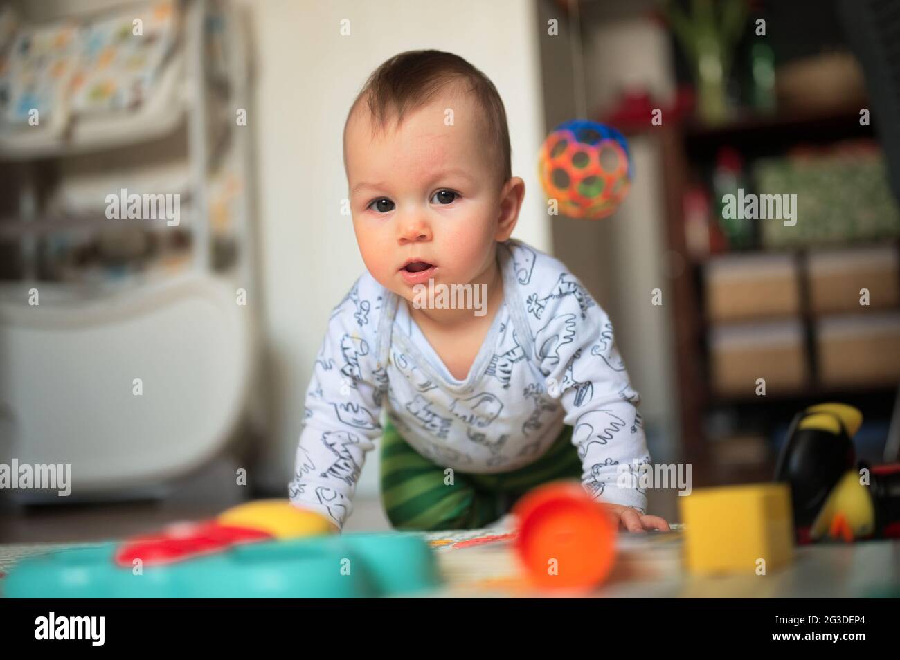 Portrait of cute little baby playing Stock Photo - Alamy