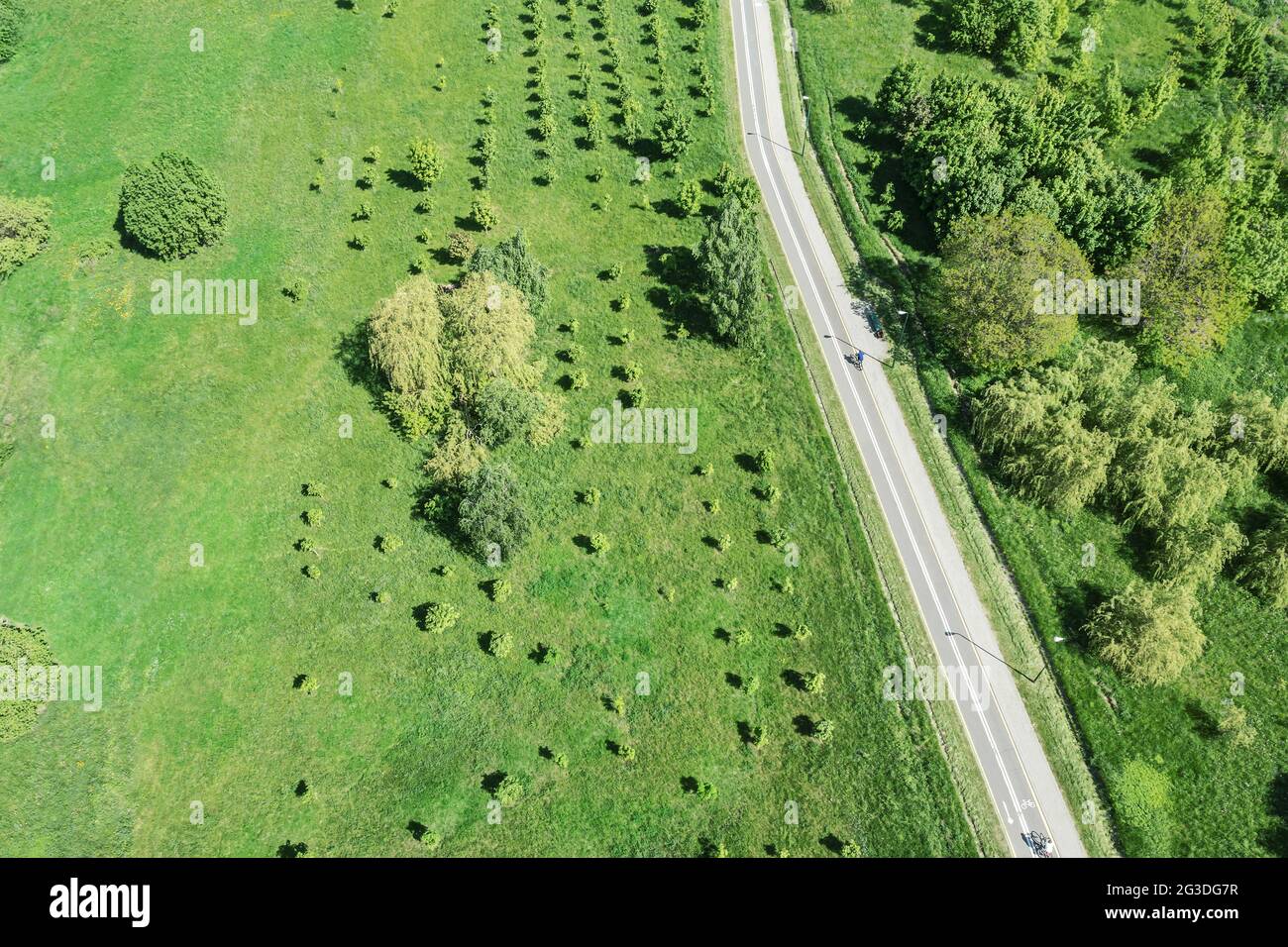outdoor bicycle lane with walking path in public park. aerial view from ...