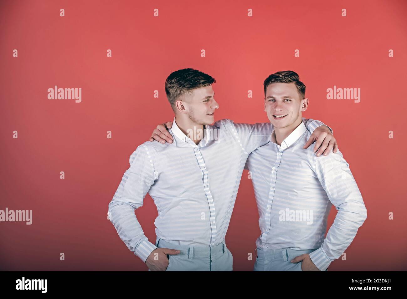 Happy men hugging Stock Photo - Alamy
