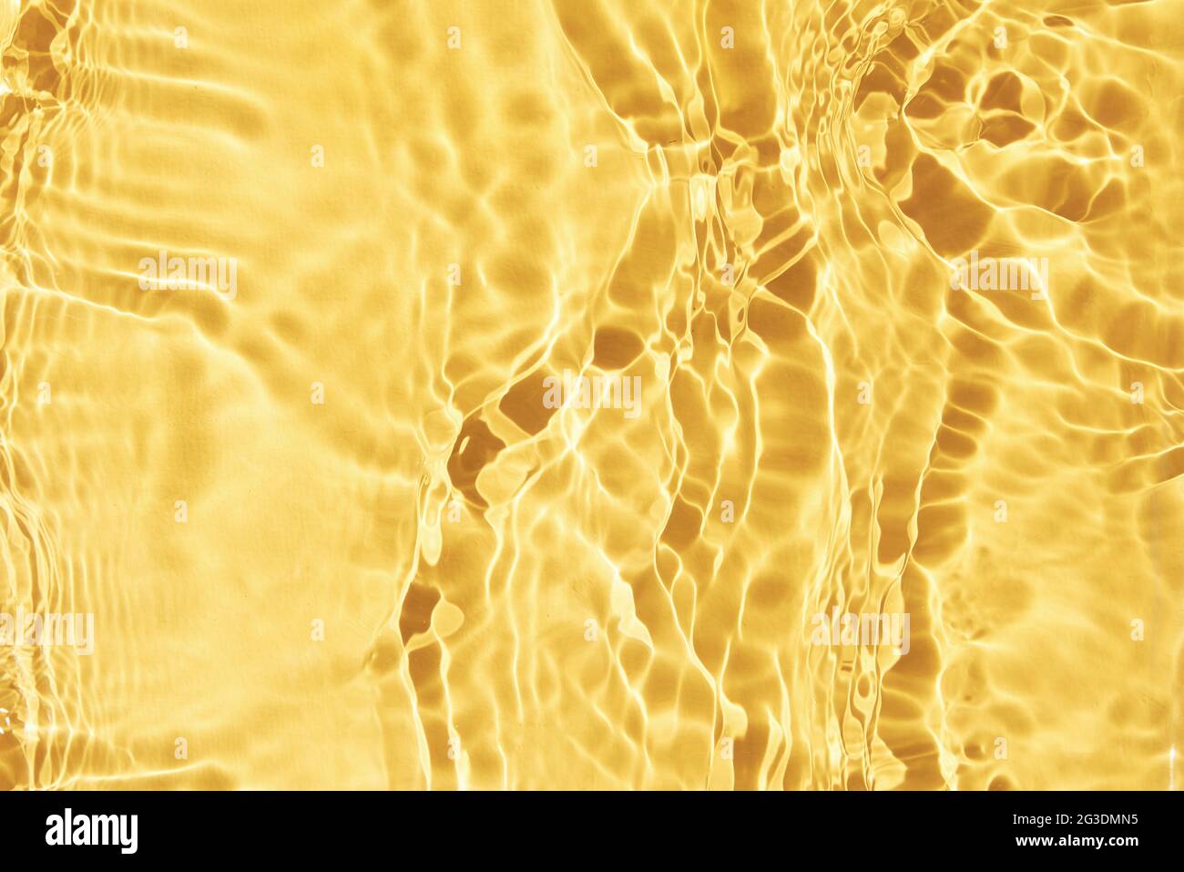 Yellow water surface background. Water texture with reflections ...