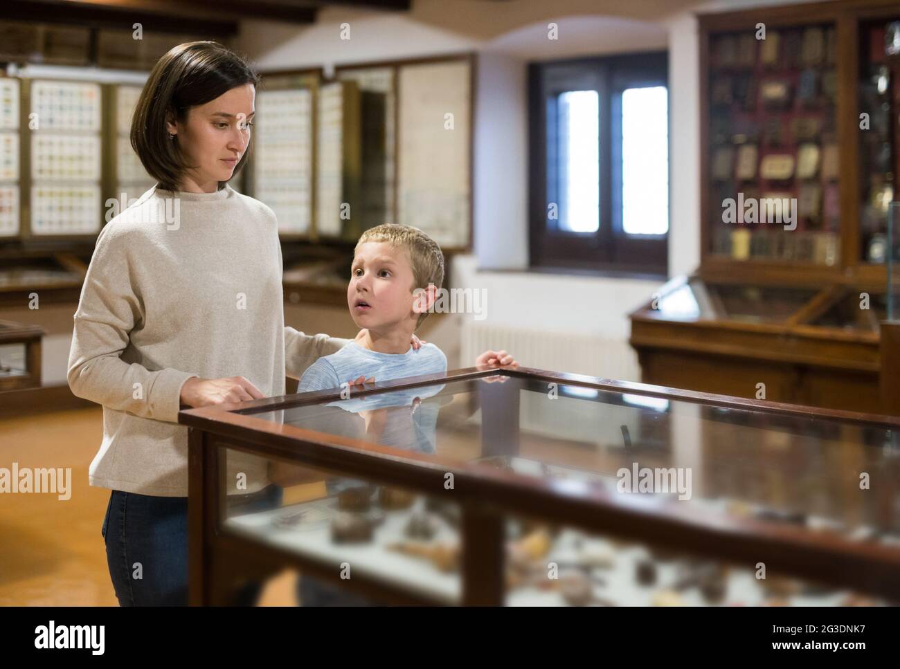 Woman and boy exploring artworks in museum Stock Photo - Alamy
