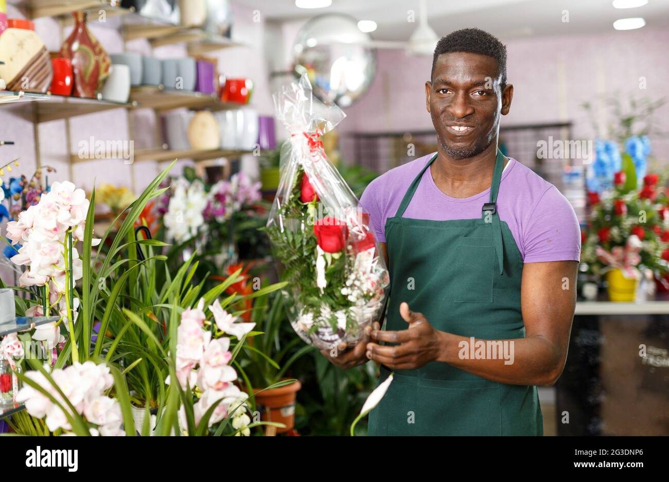 Florist offering flower arrangements Stock Photo - Alamy