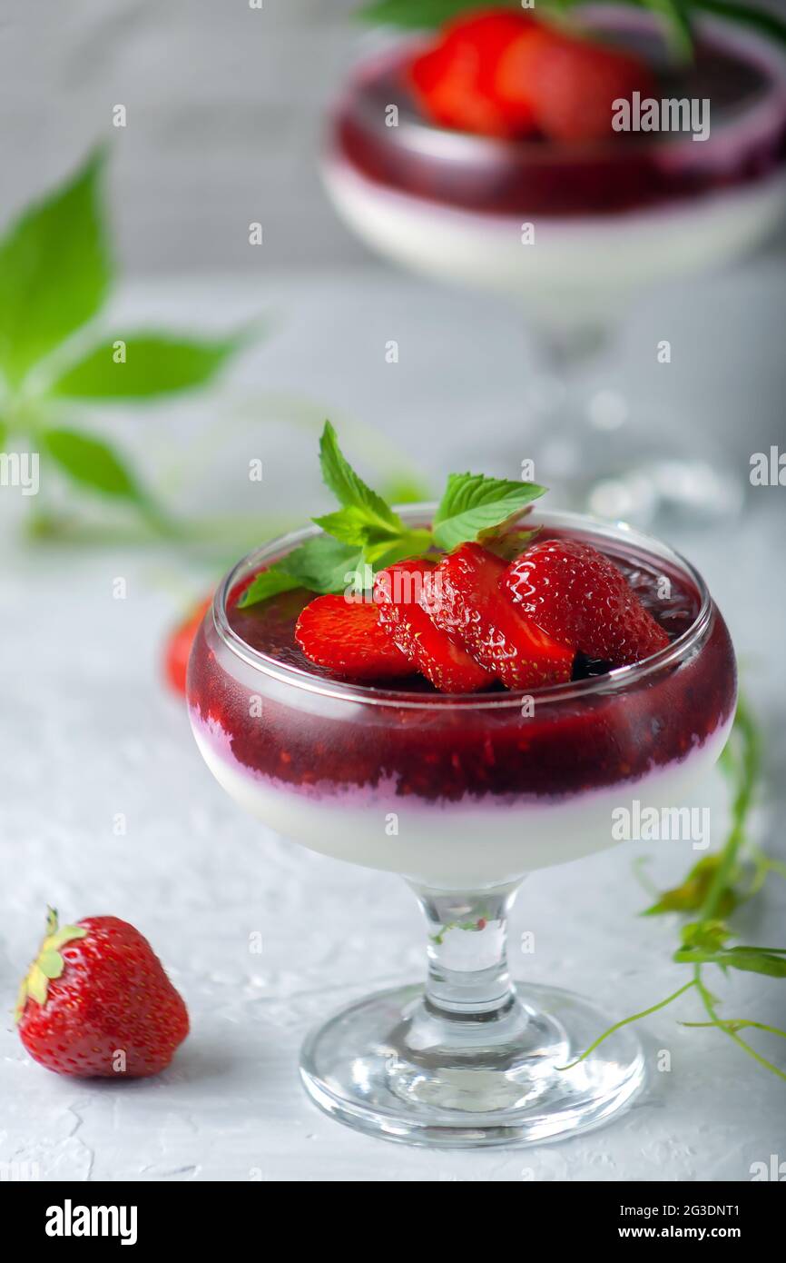 Italian dessert vanilla-strawberry panna cotta in verina with fresh ...