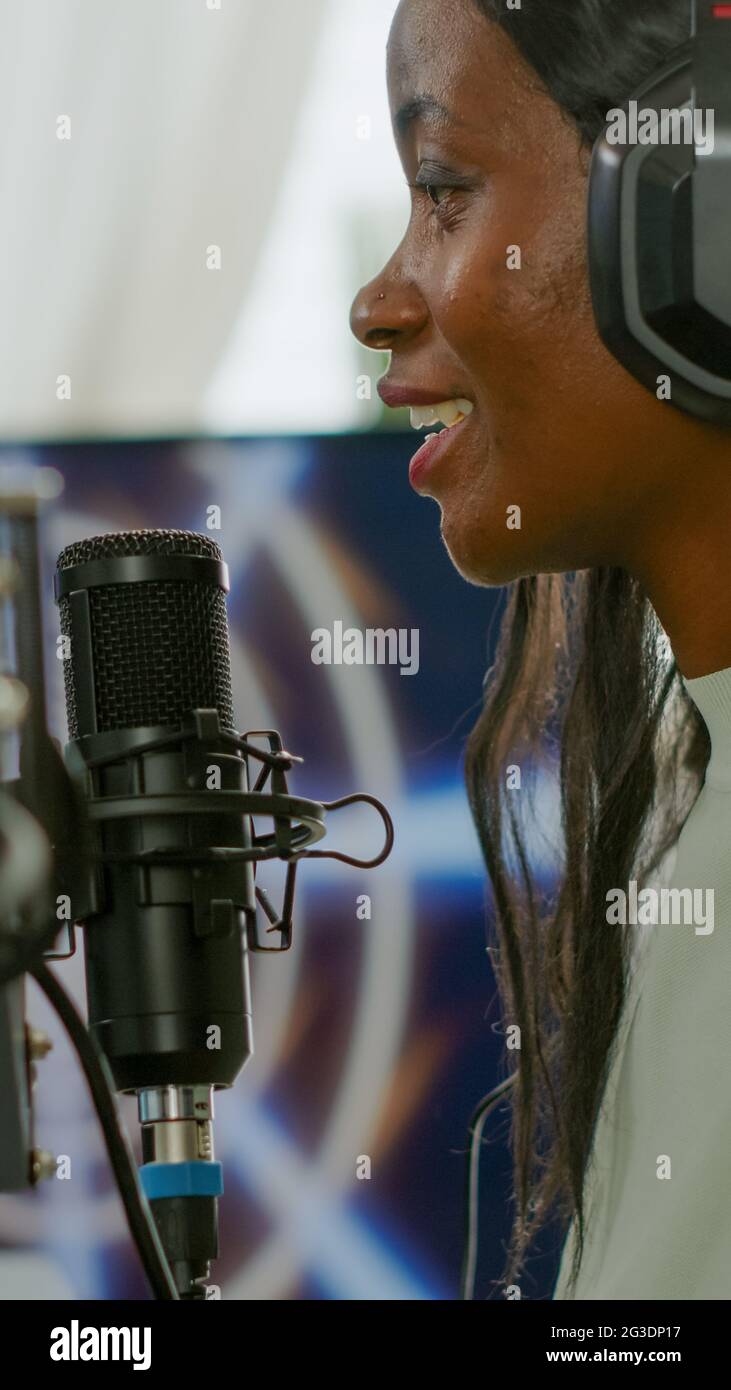 African american esport streamer talking into micrphone trying to beat ...