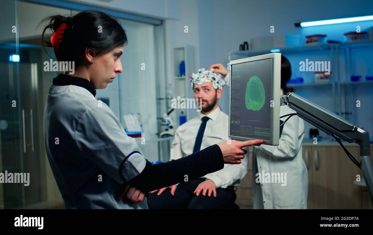 Woman researcher looking monitor analysing hi-res stock photography and ...