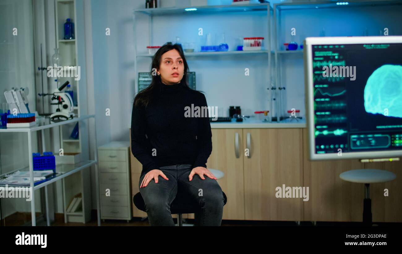 Stressed patient sitting on chair in neurological laboratory waiting ...