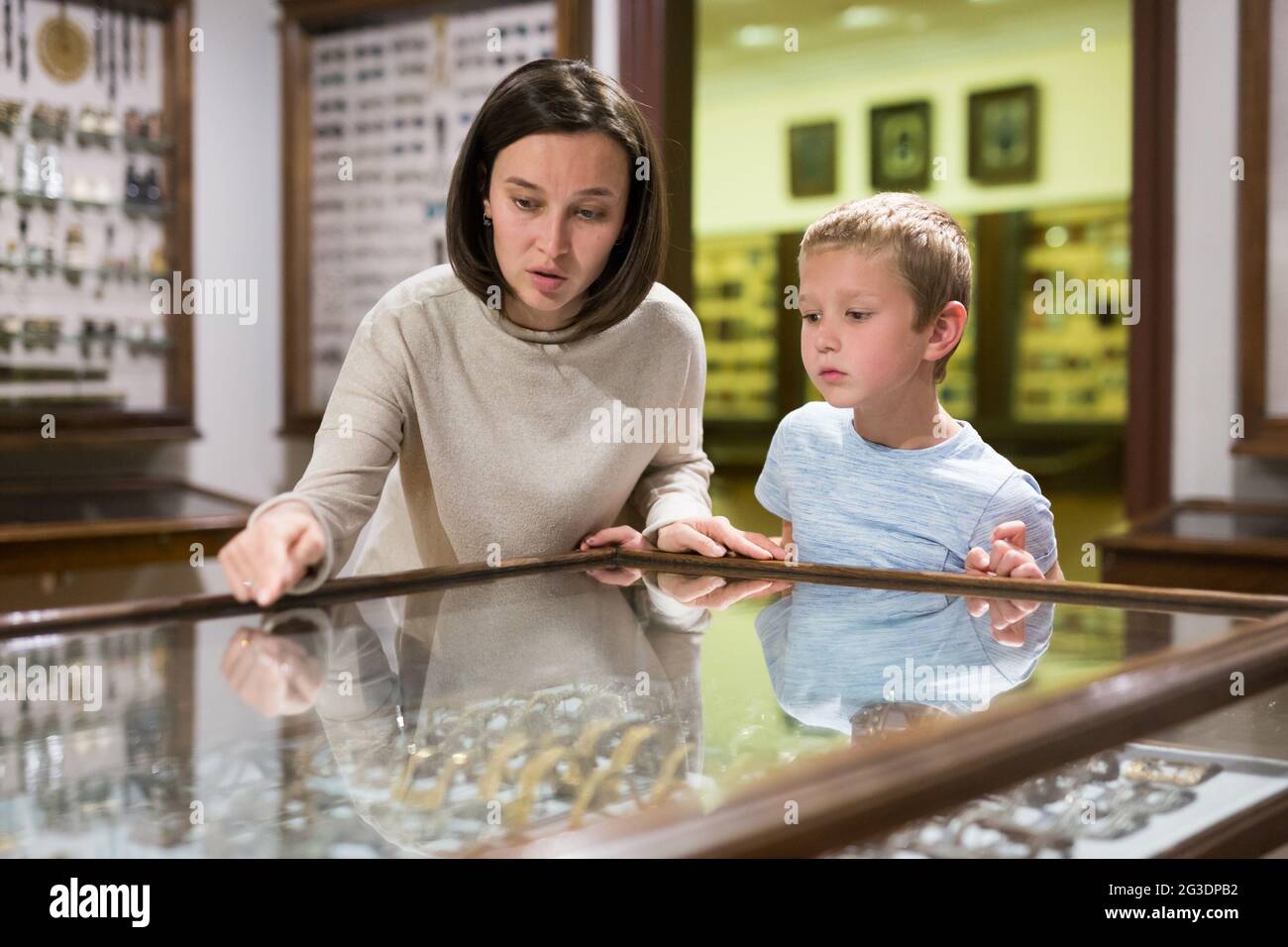 Woman and boy exploring artworks in museum Stock Photo - Alamy