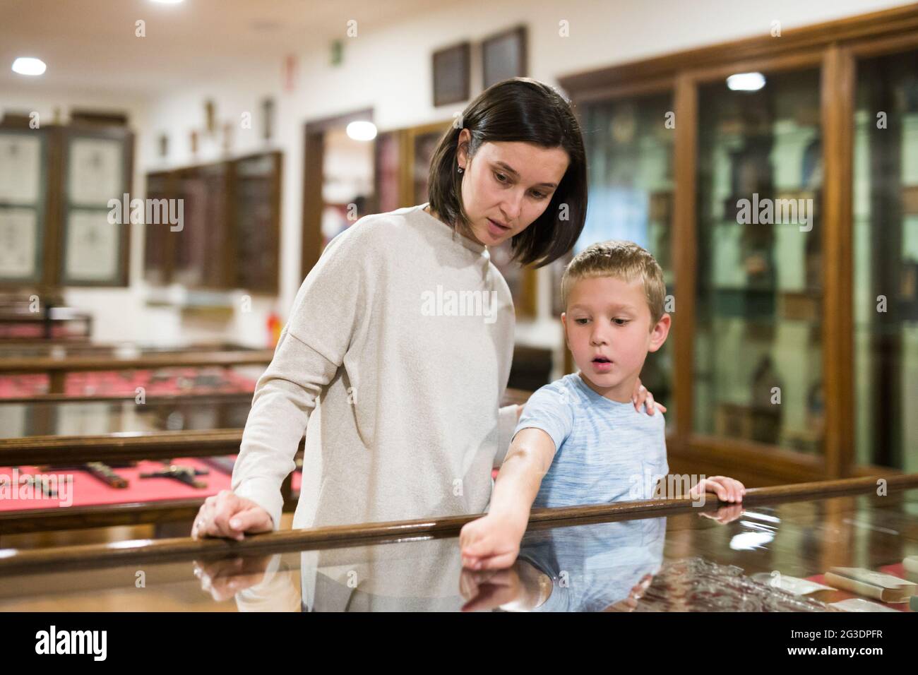 Woman and boy exploring artworks in museum Stock Photo - Alamy