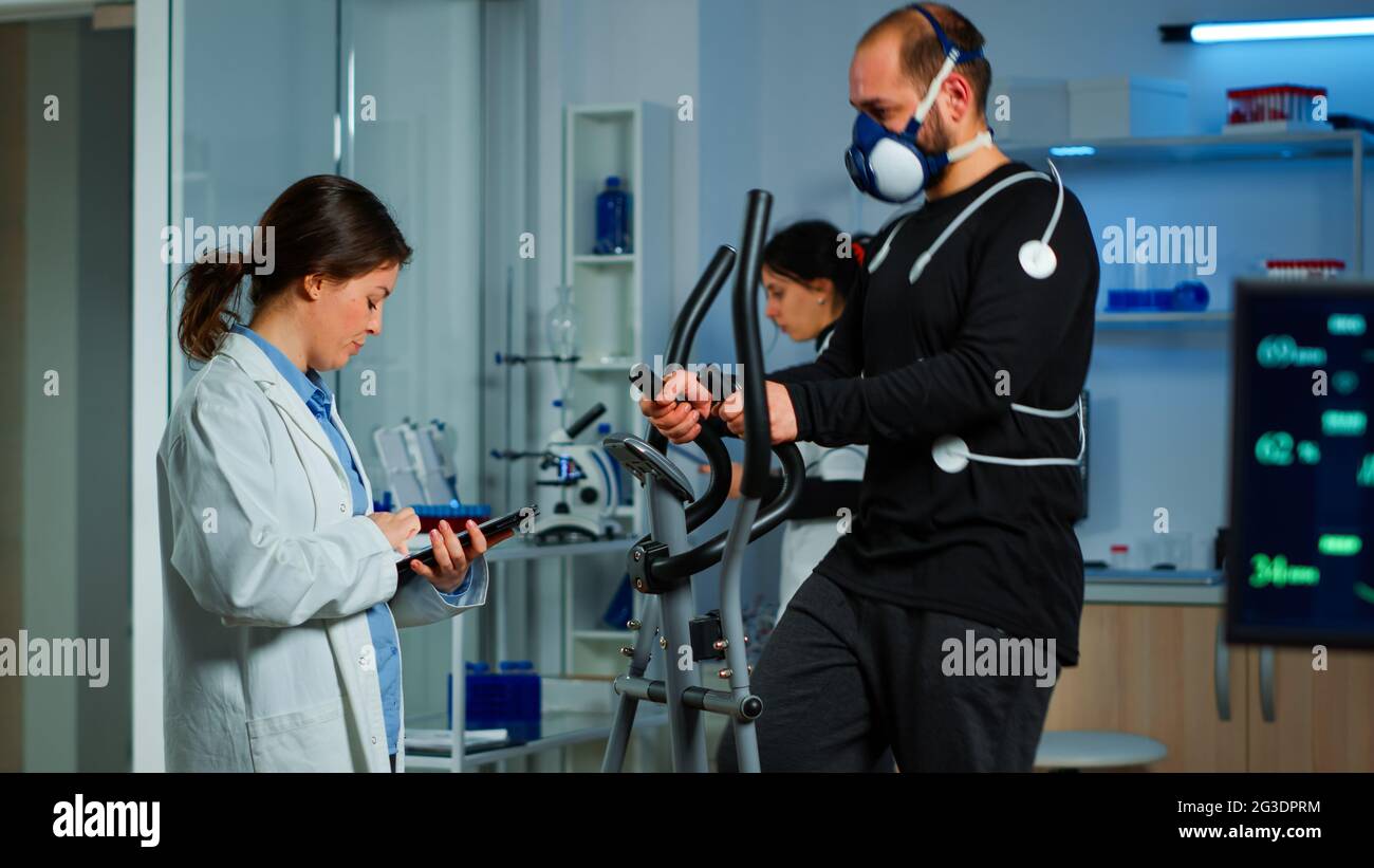 Science sport doctor asking patient about his health while sportsman ...