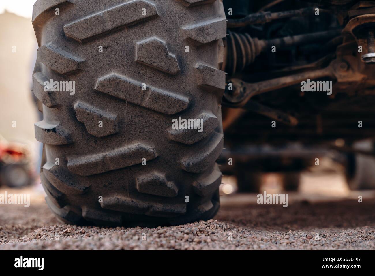 Big ATV wheel up close in the desert. An important part of an ATV Stock ...