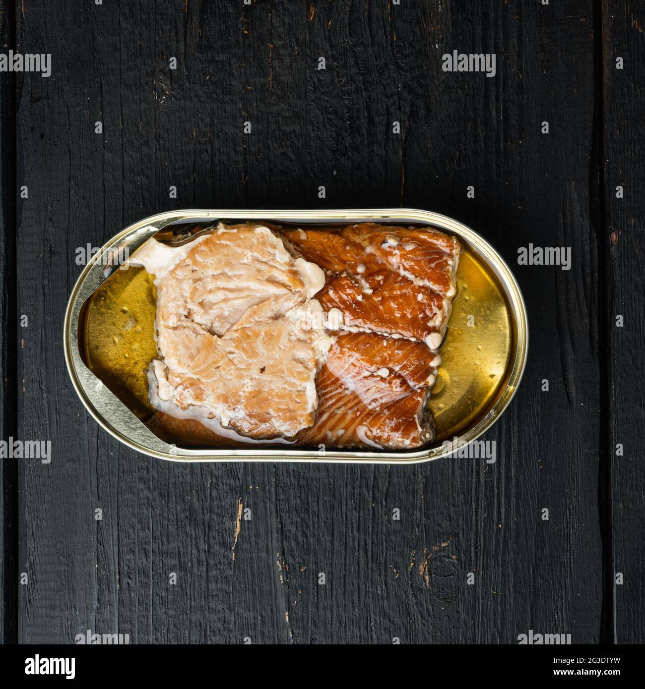 Wild Pink Salmon Canned smoked fish set, in tin can, on black wooden ...