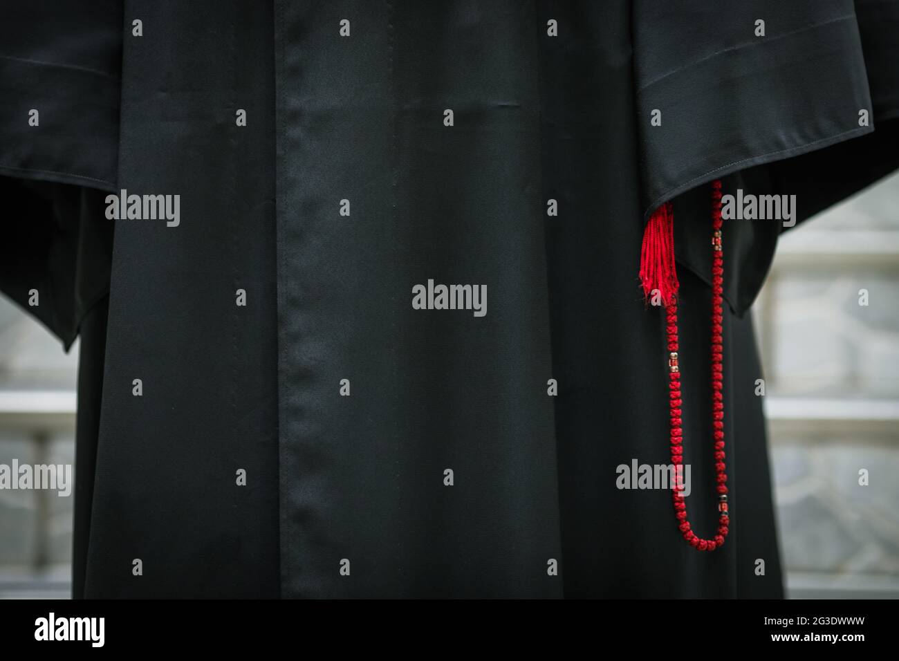 Details with the prayer rope and robe of a high ranking Romanian priest ...