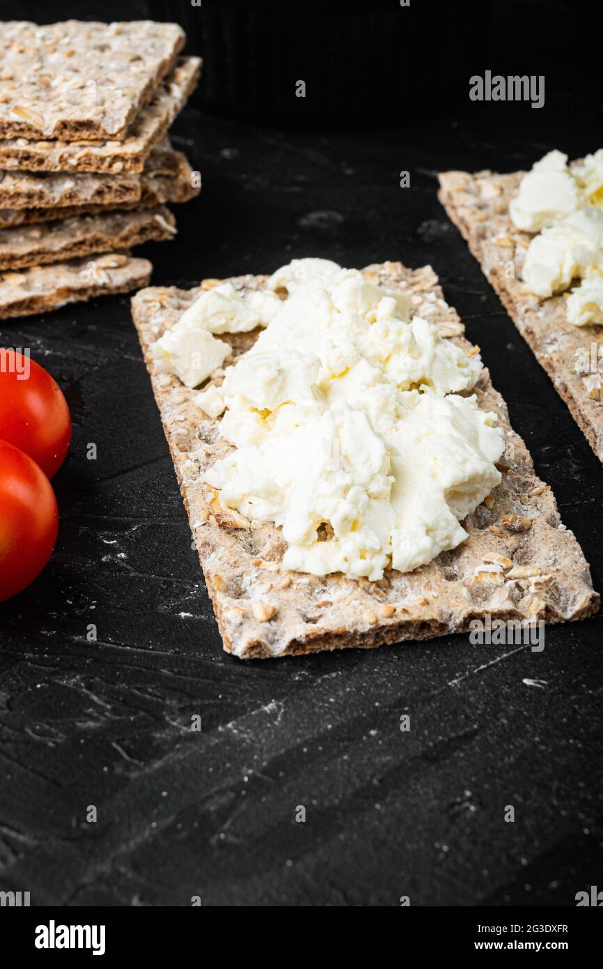 Homemade Crisp bread toast with Cottage Cheese set, on black dark stone ...
