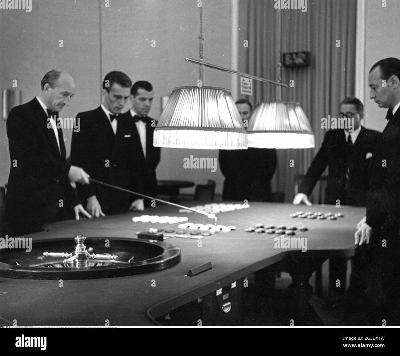 Croupier stick Black and White Stock Photos & Images - Alamy