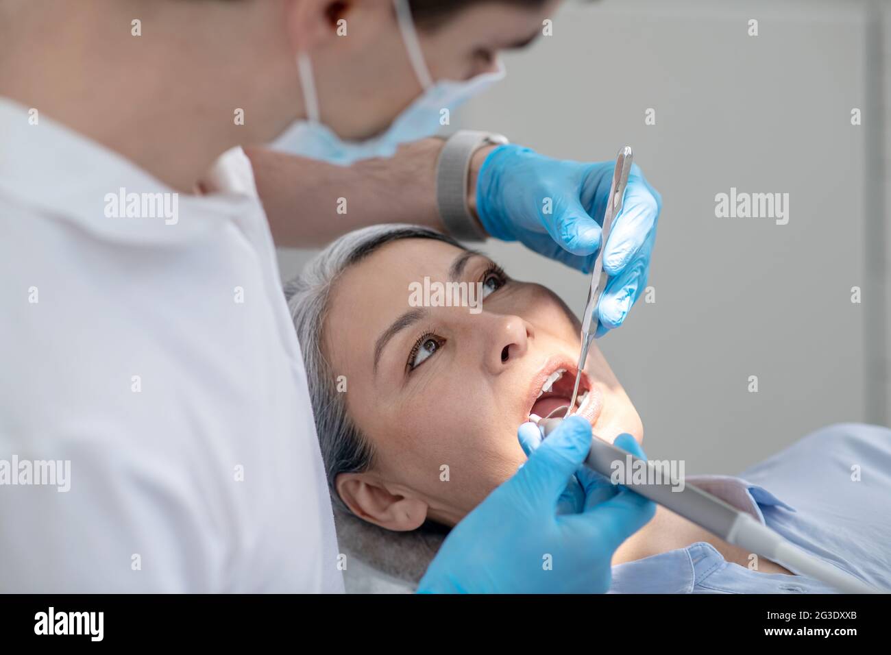 Dentist working on patients teeth restoration and making dental ...