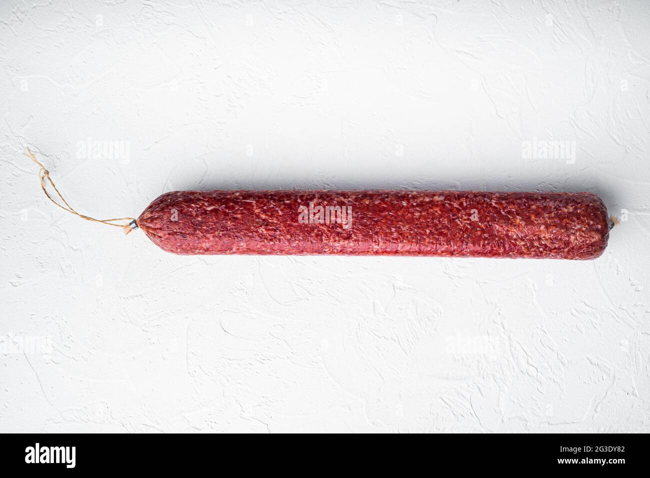 Delicious salami sausage set, on white stone background, top view flat ...