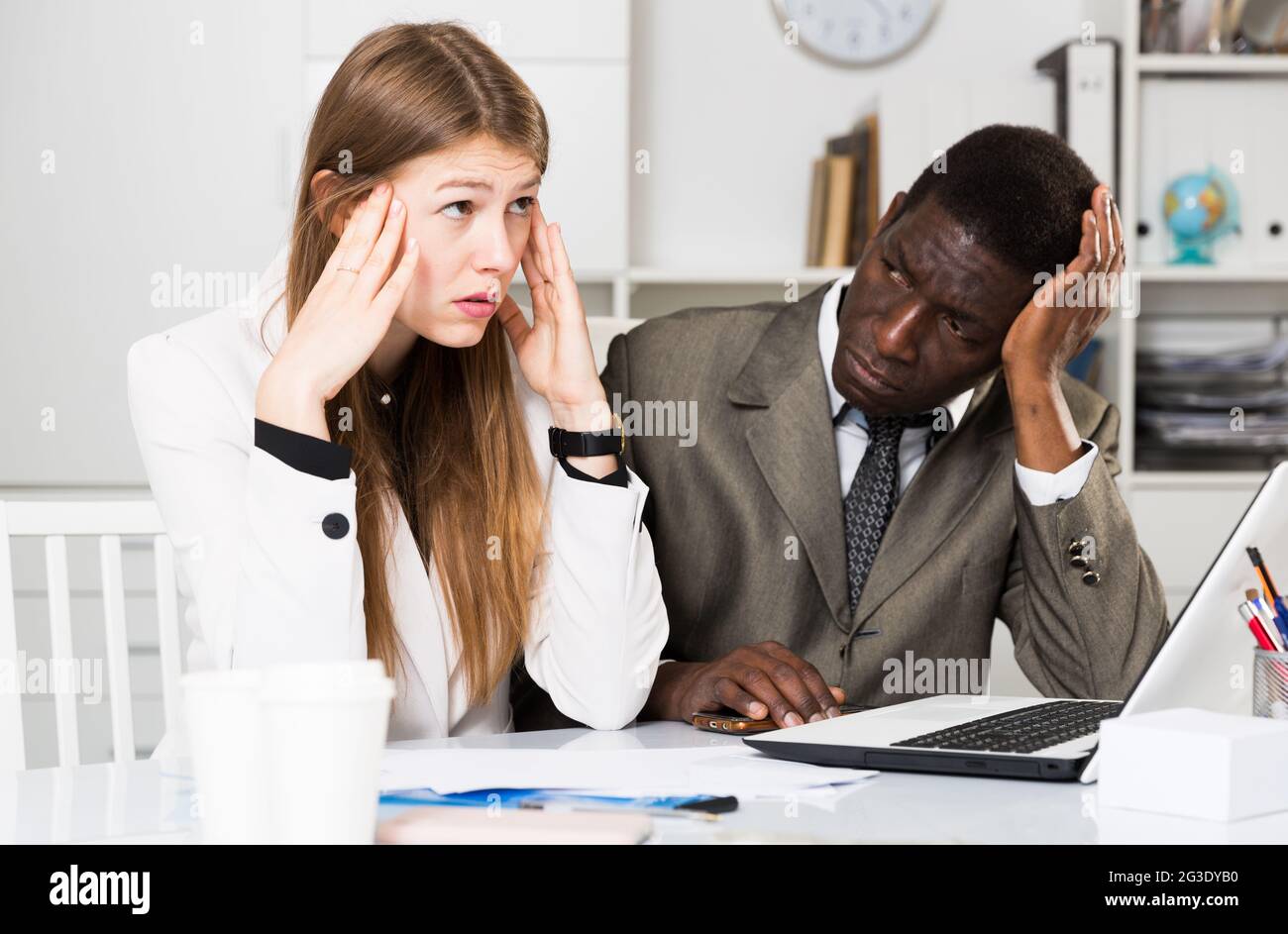 Upset coworkers working together Stock Photo - Alamy