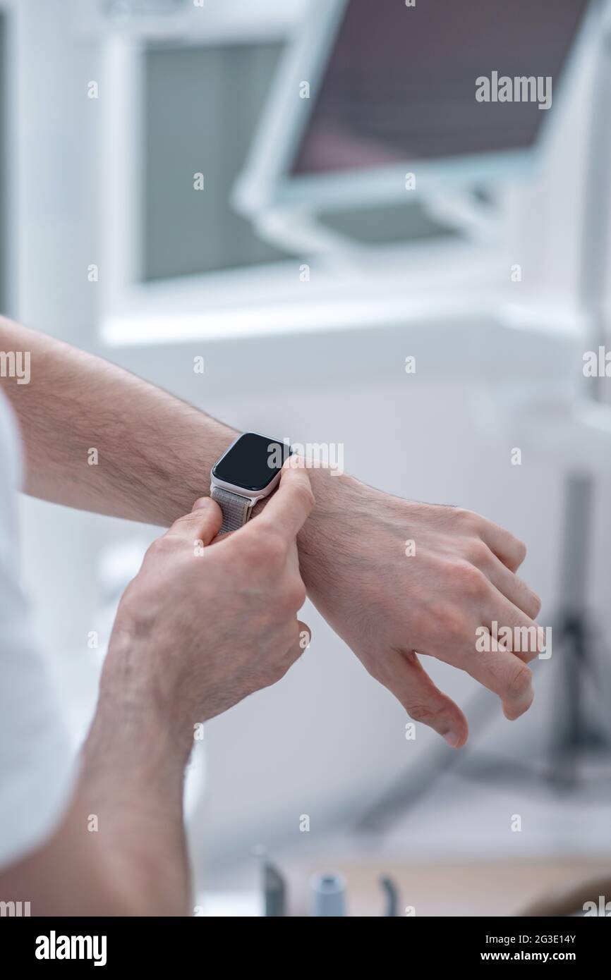 Close up picture of a male arm with a smartwatch Stock Photo - Alamy