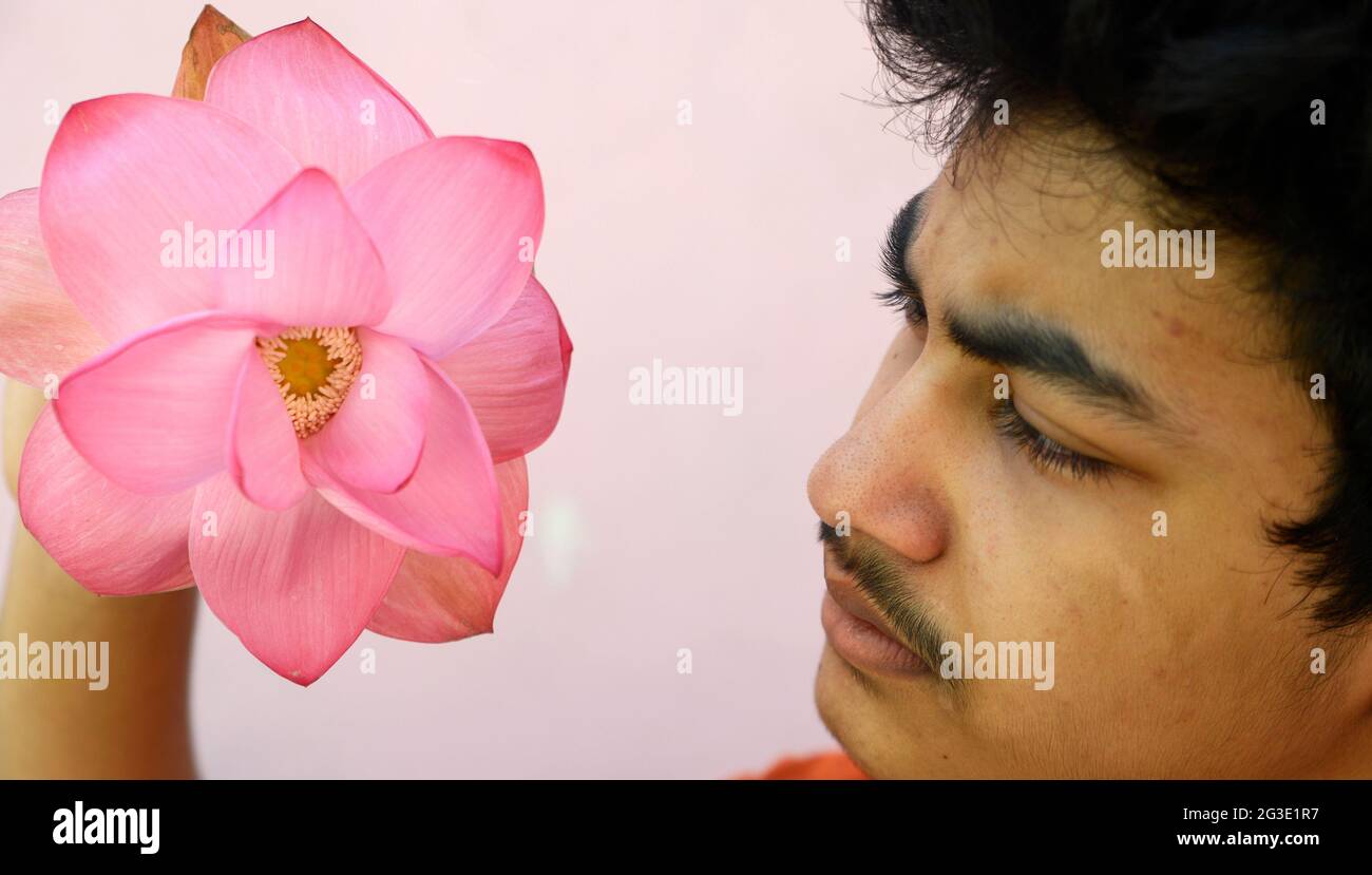 Boy showing Lotus flower Stock Photo - Alamy