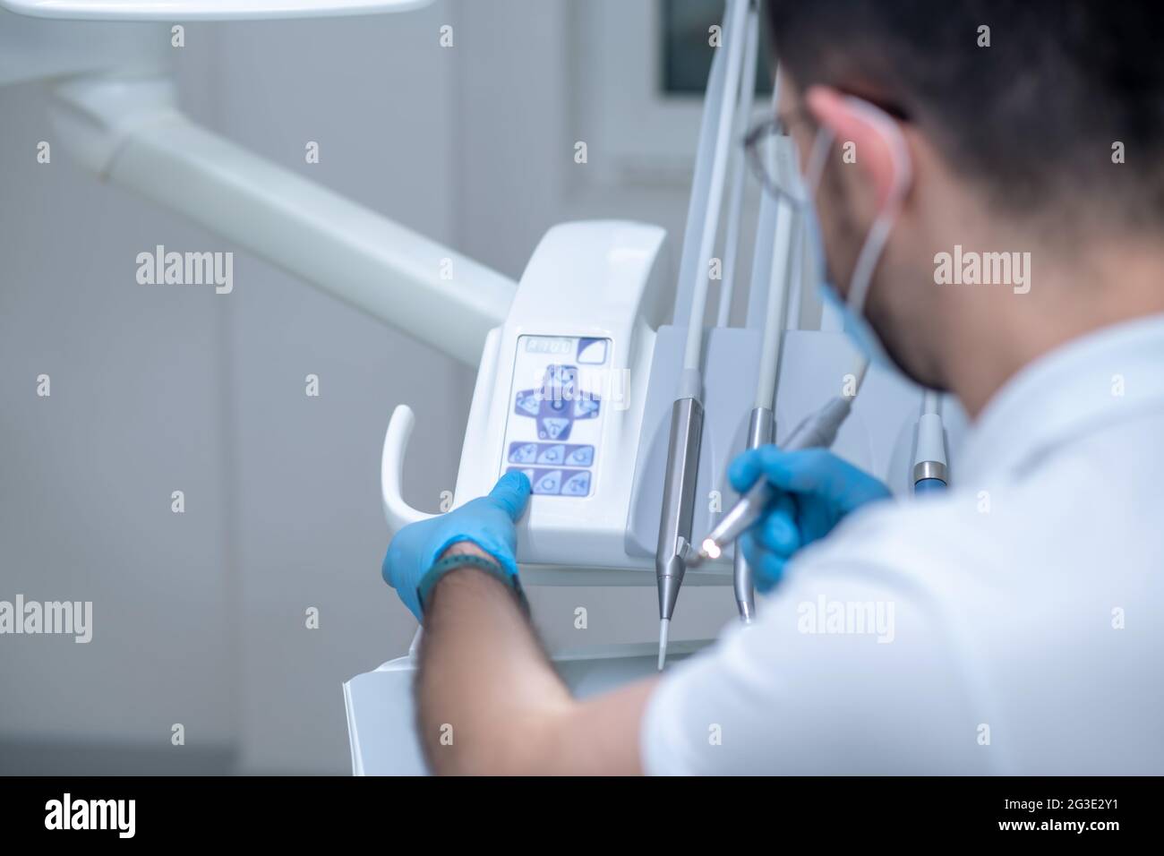 Dentist using dental equipment hi-res stock photography and images - Alamy
