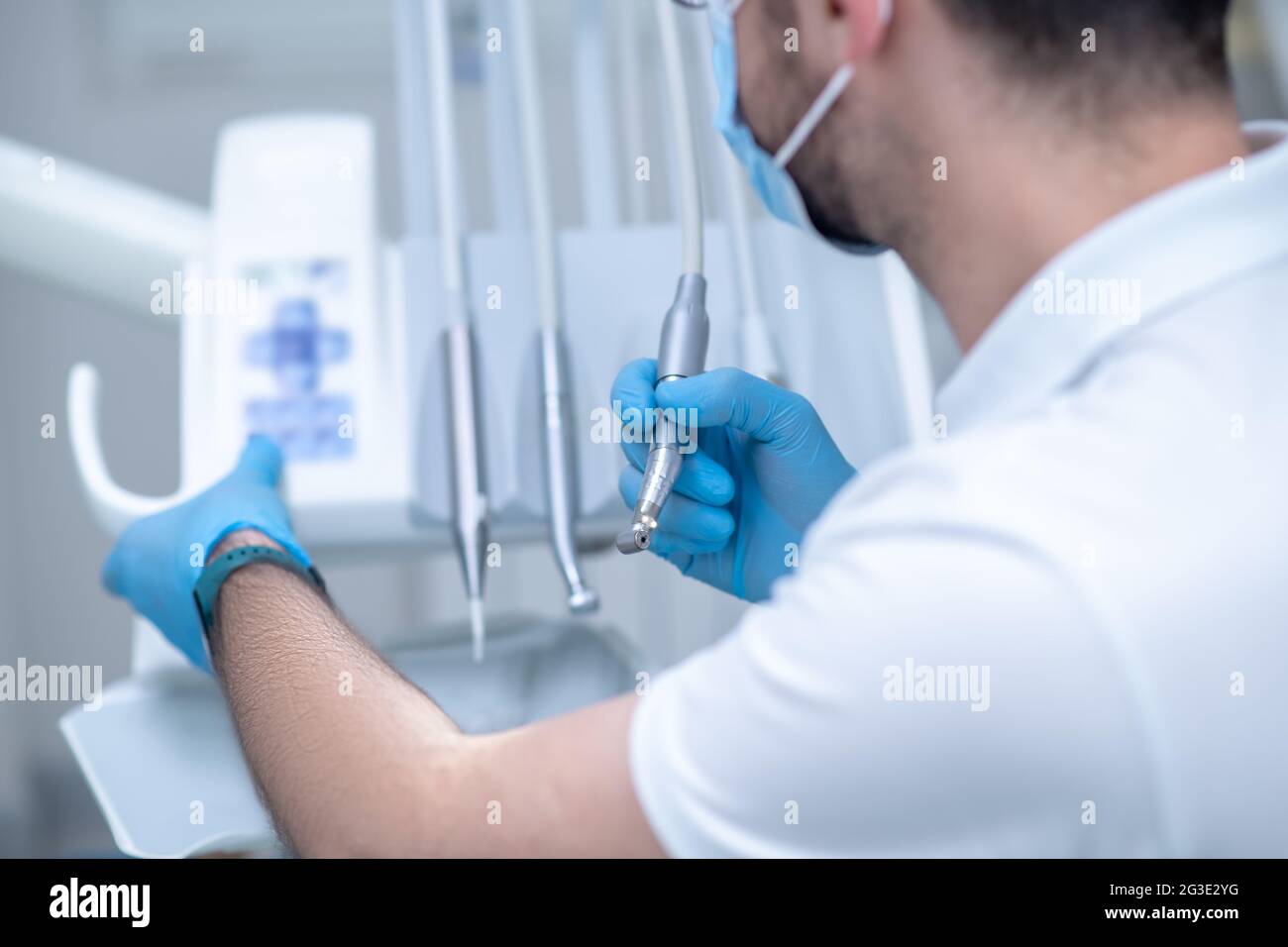 Dentist using dental equipment hi-res stock photography and images - Alamy